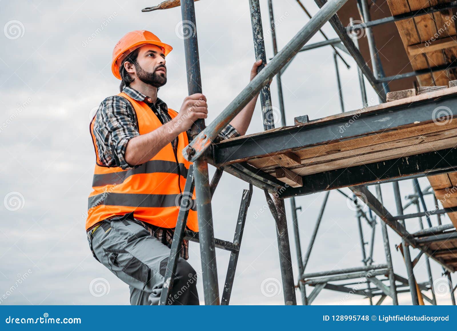 Bearded Builder Climbing on Scaffolding Stock Photo - Image of ...