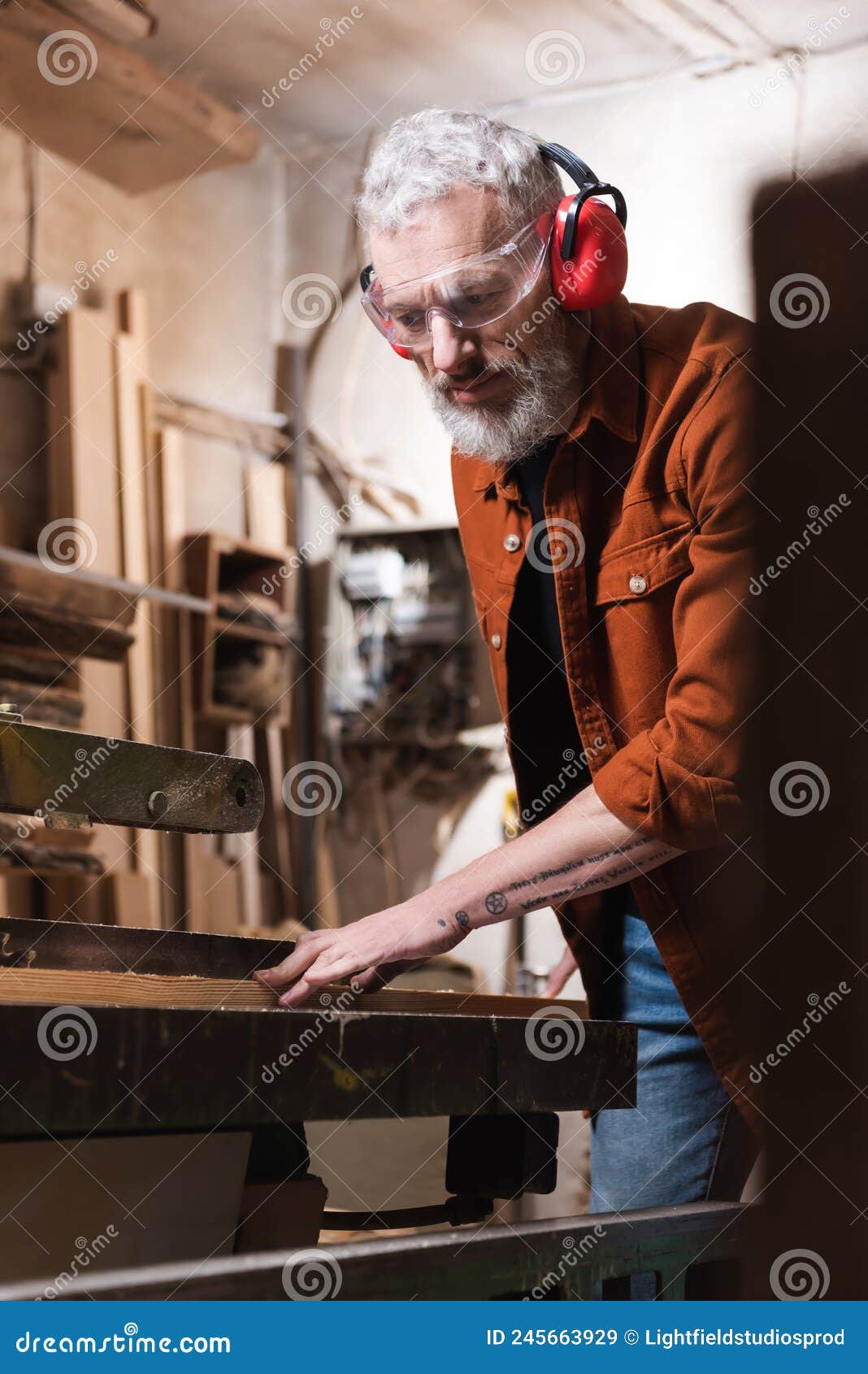 Bearded Carpenter Working at Workbench on Stock Image - Image of ...