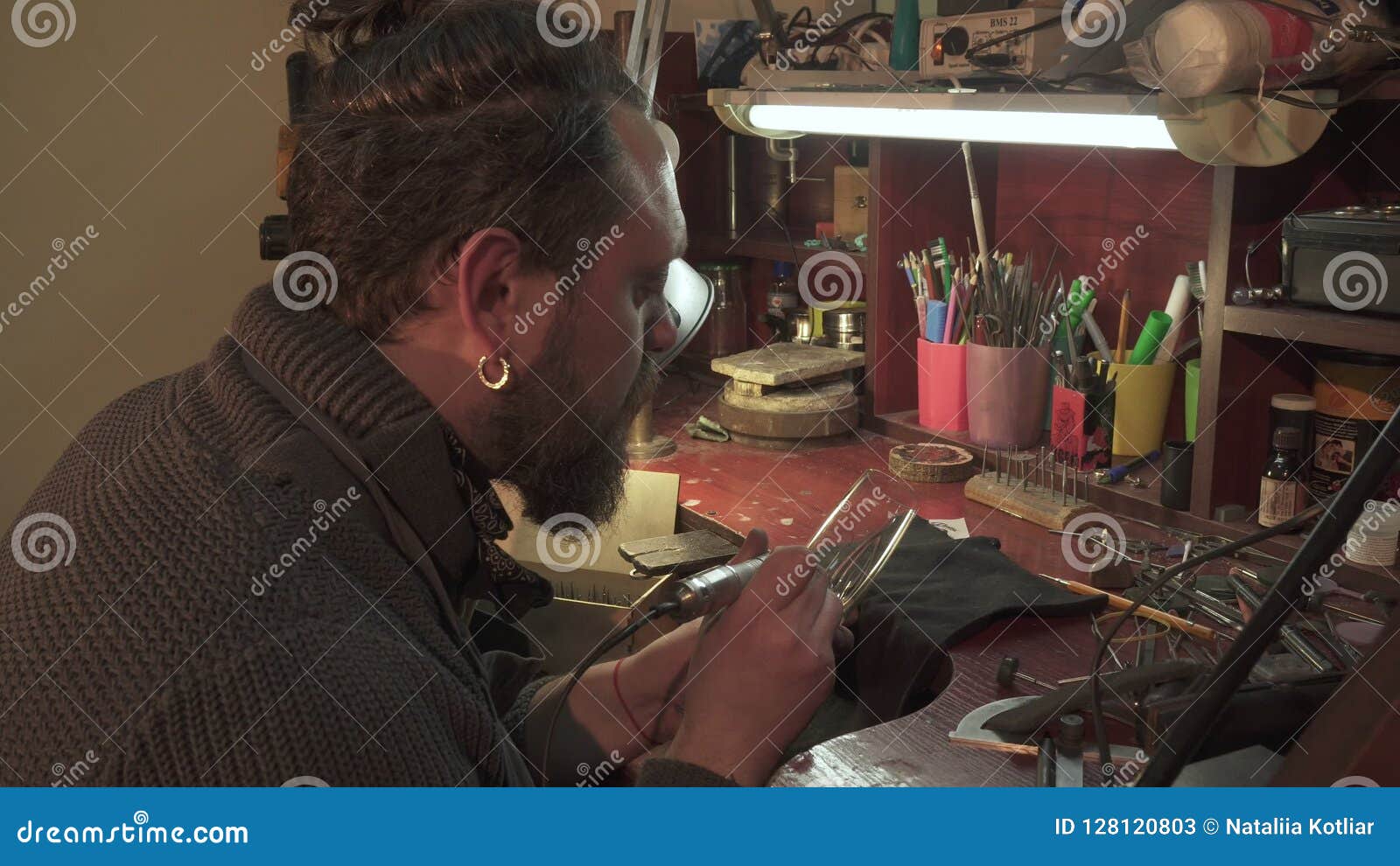 Man uses engraver tool stock image. Image of decoration - 128120803