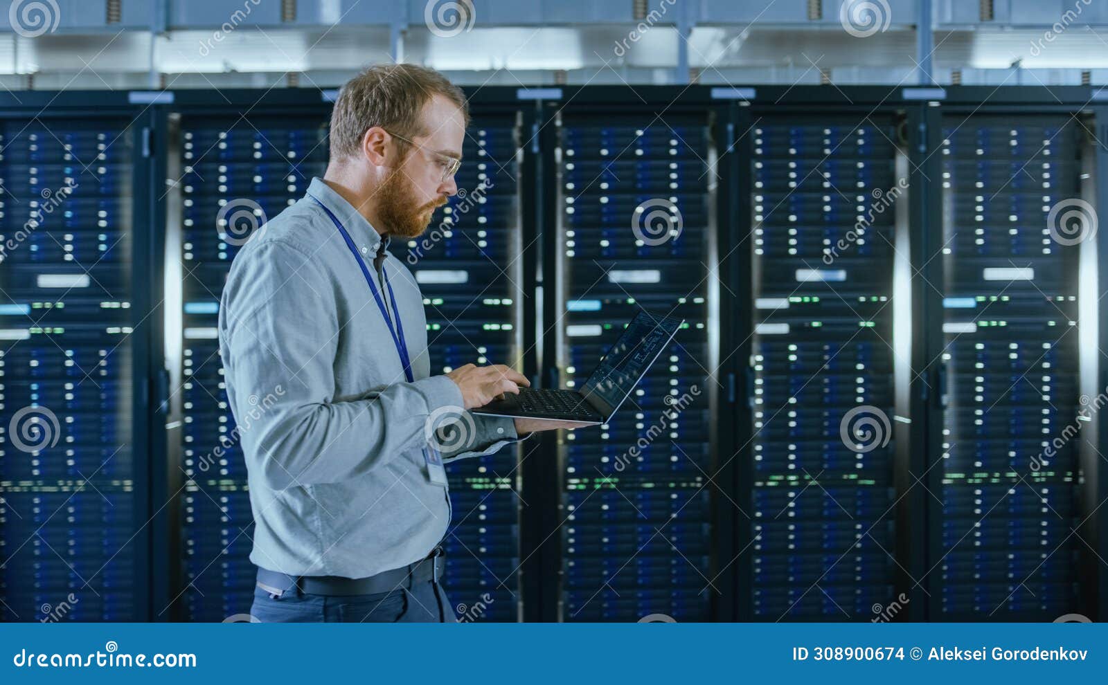 Bearded Data Center it Engineer in Glasses is Walking through Server ...