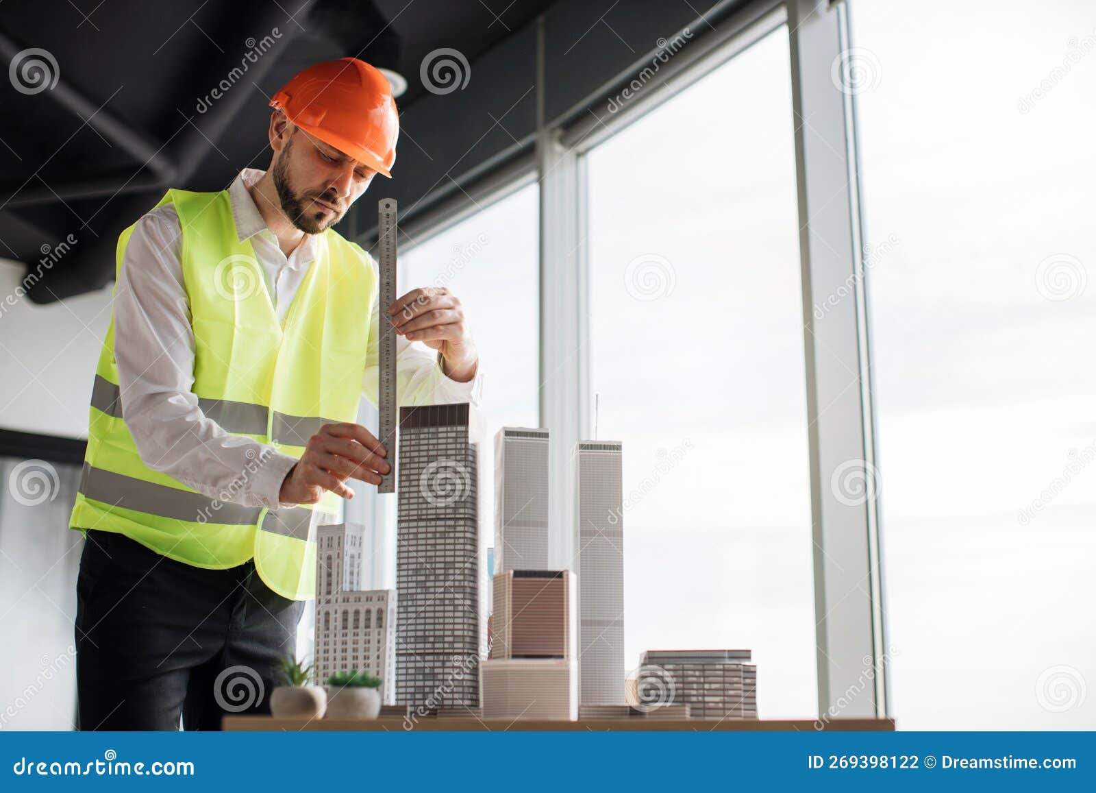 Bearded Engineer in Protective Helmet Working on Building Complex ...