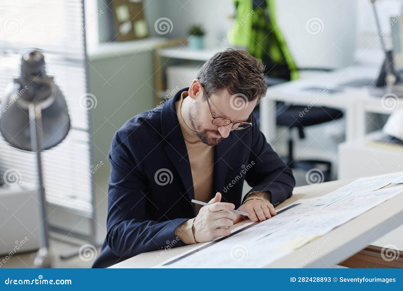 Bearded Engineer at Workstation Drawing Blueprints and Plans Stock ...