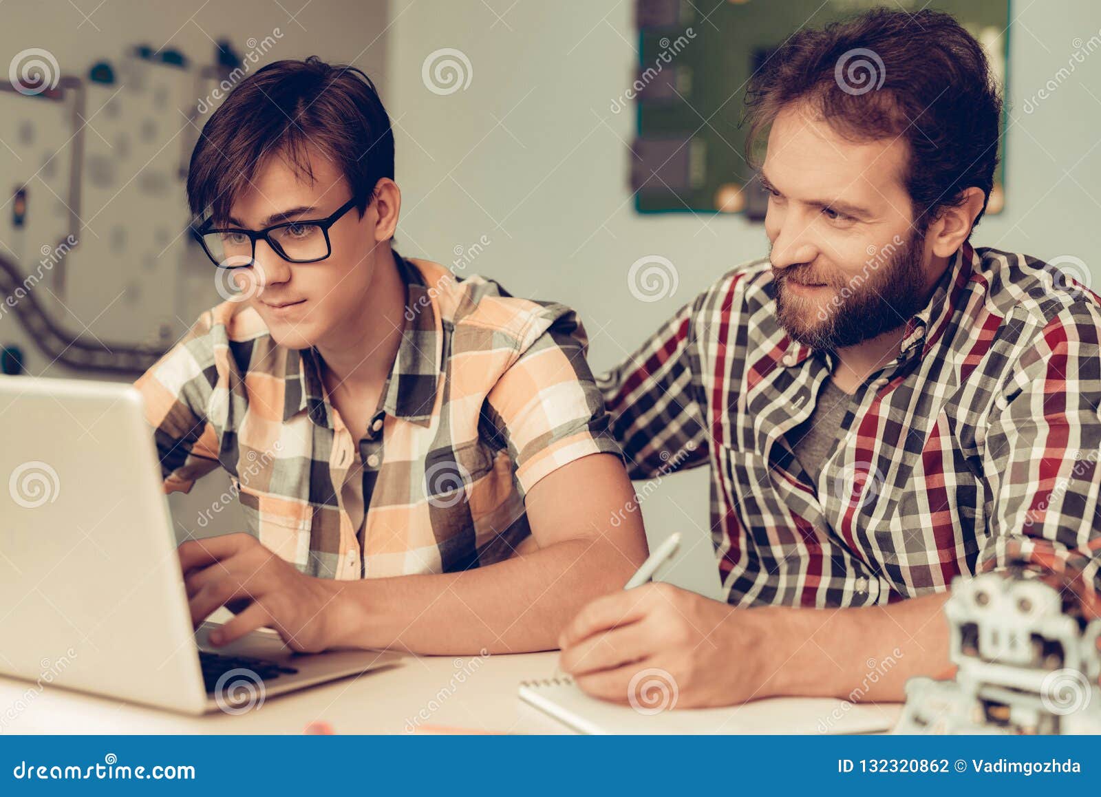 Bearded Father Help Son To Program Robot at Home. Stock Photo - Image ...