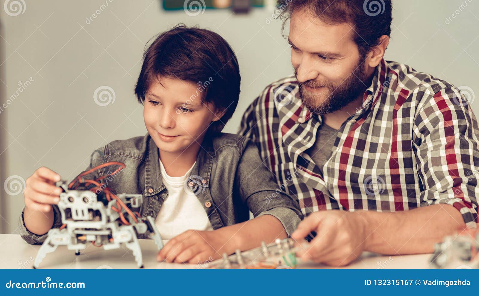 Bearded Father and Son Constructing Robot at Home Stock Image - Image ...