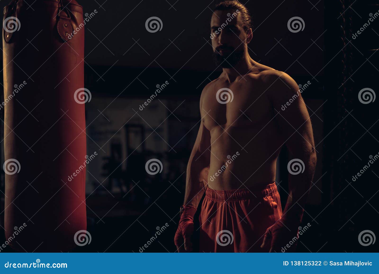 Bearded Fighter Standing by the Heavy Bag Stock Photo - Image of ...