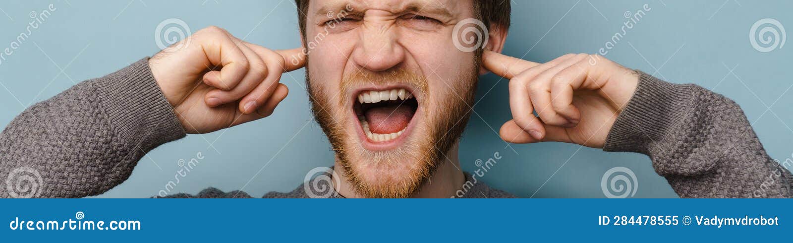 Bearded Ginger Man Screaming while Plugging His Ears Stock Image ...