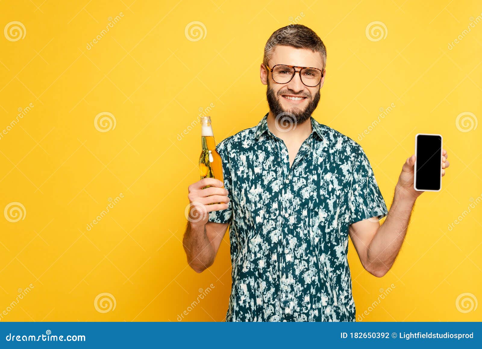 Bearded Guy In Glasses With Refreshing Bottle Of Beer Showing