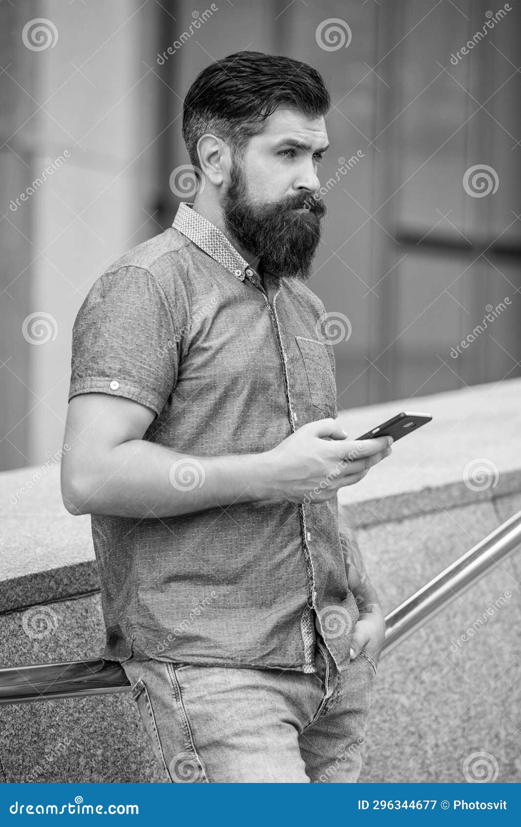 Bearded Guy Using Mobile Phone Device for Mobile Sms Messaging Outdoors ...