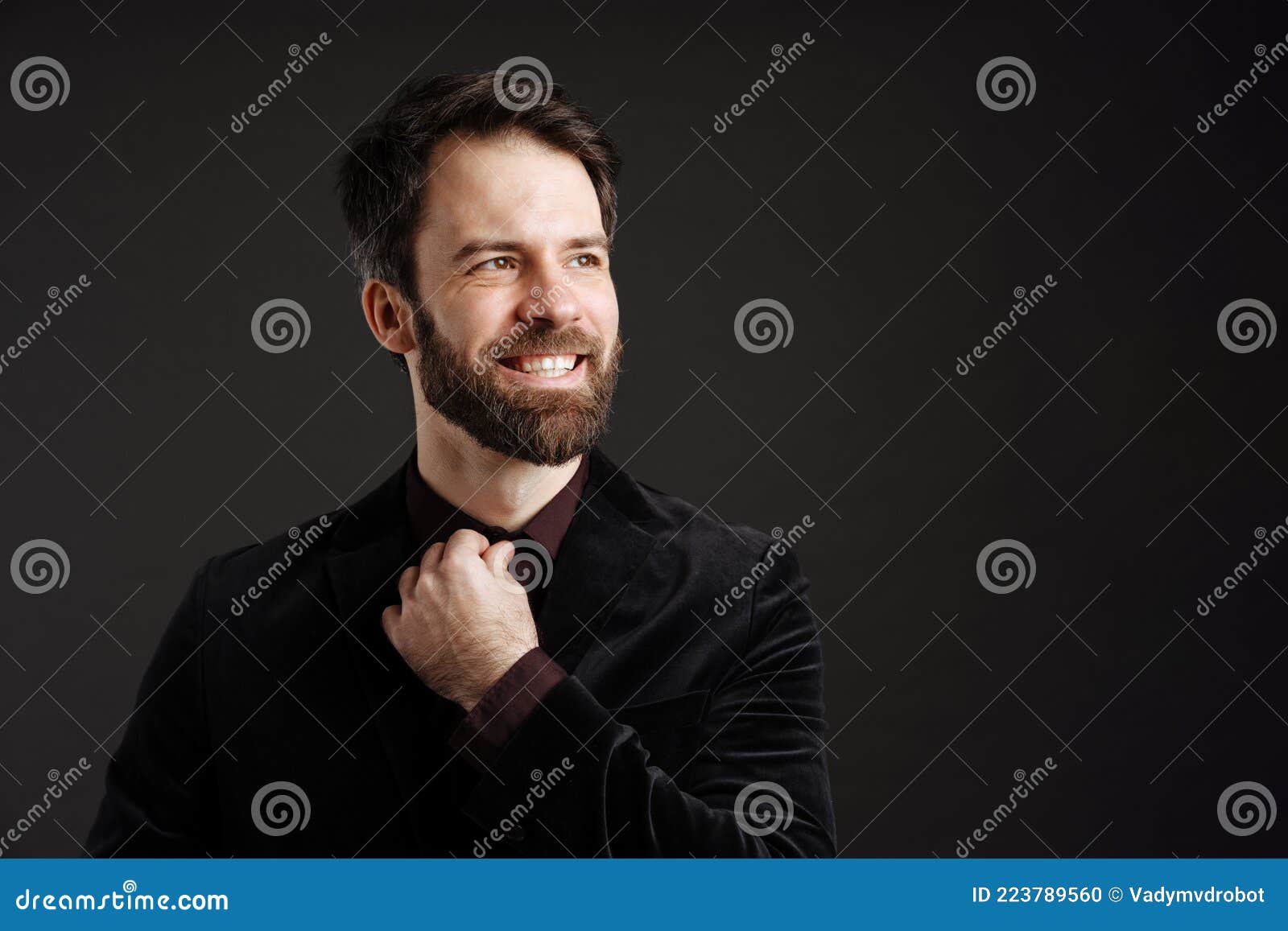 Bearded Happy Man in Black Jacket Smiling and Looking Aside Stock Photo ...