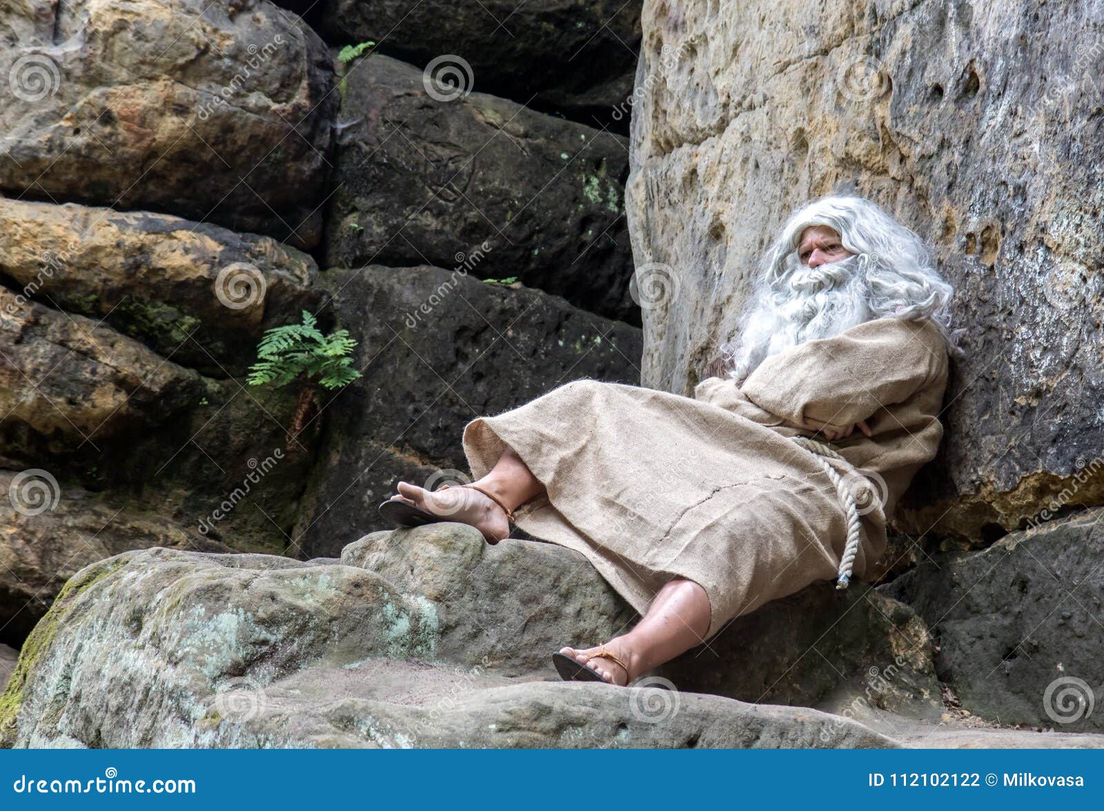 Bearded Hermit Sitting at the Rock Stock Photo - Image of emotion ...