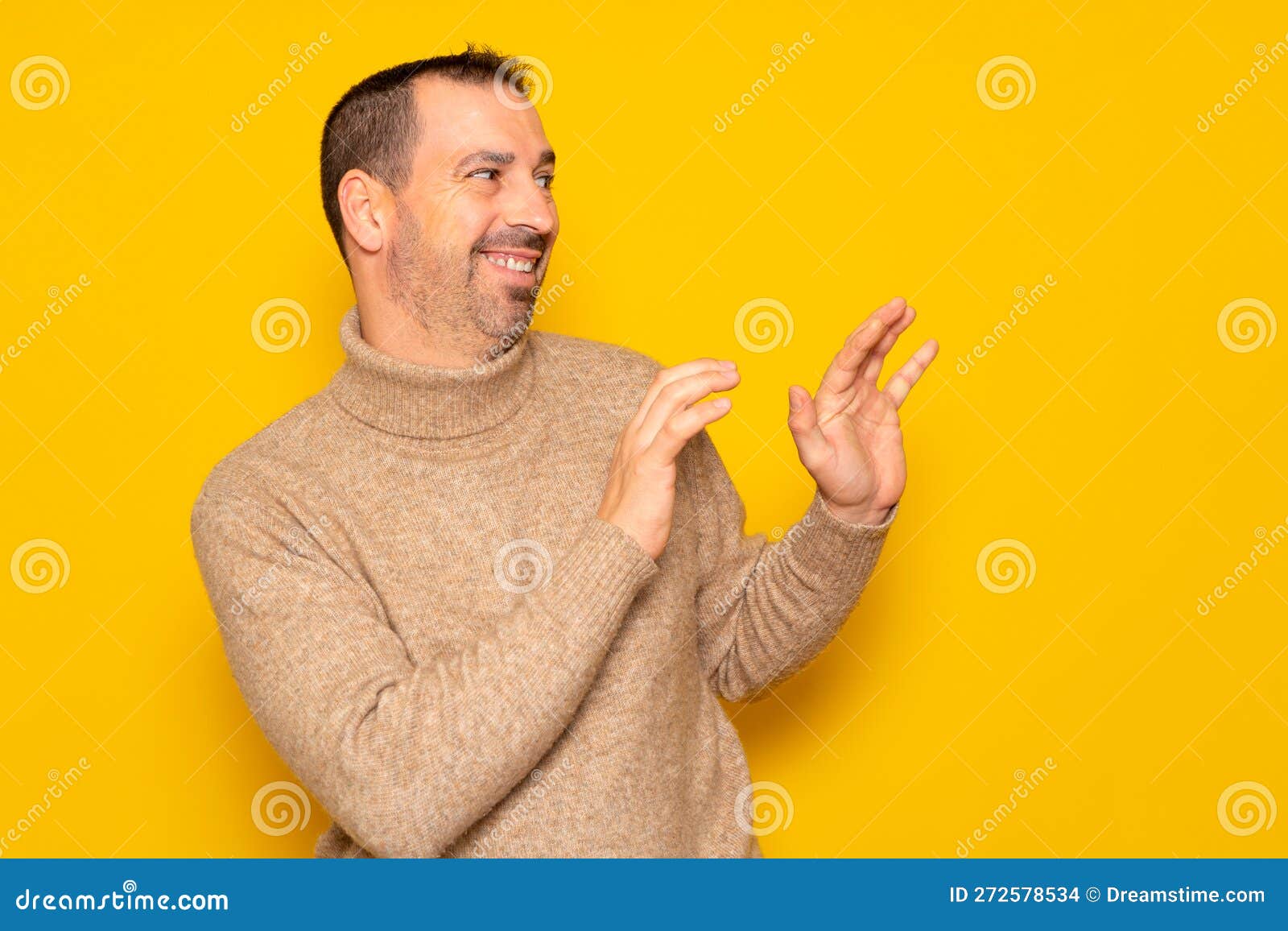 Bearded Hispanic Man In A Turtleneck Ducking To The Side In Embarrassment Tries To Push Away