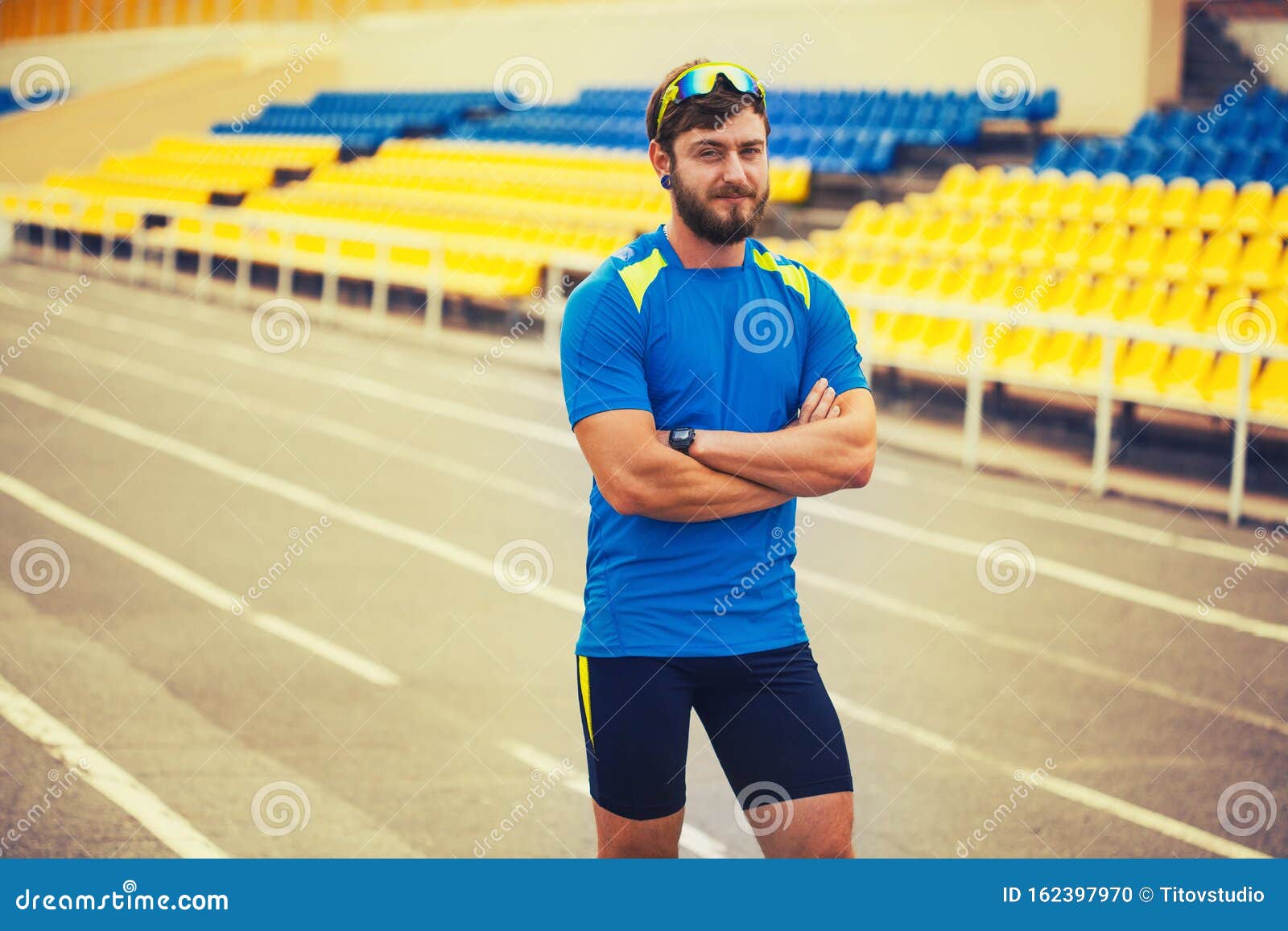 Bearded Male Athlete is Training in the Stadium Stock Photo - Image of ...