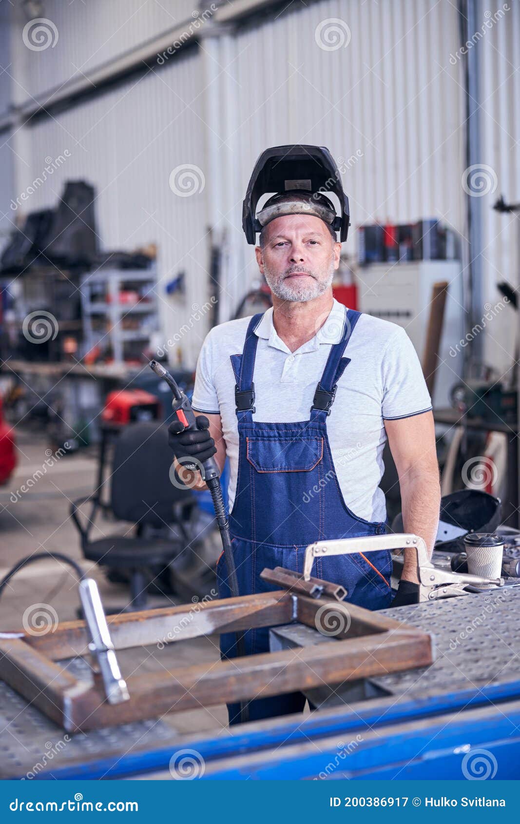 Bearded Male Worker Using Welding Torch in Garage Stock Image - Image ...