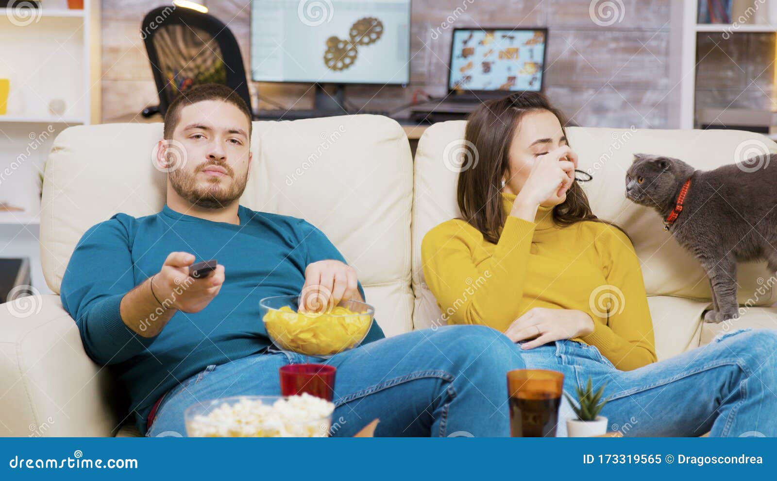 Bearded Man Eating Chips and Using Remote Control To Change Tv Channels ...