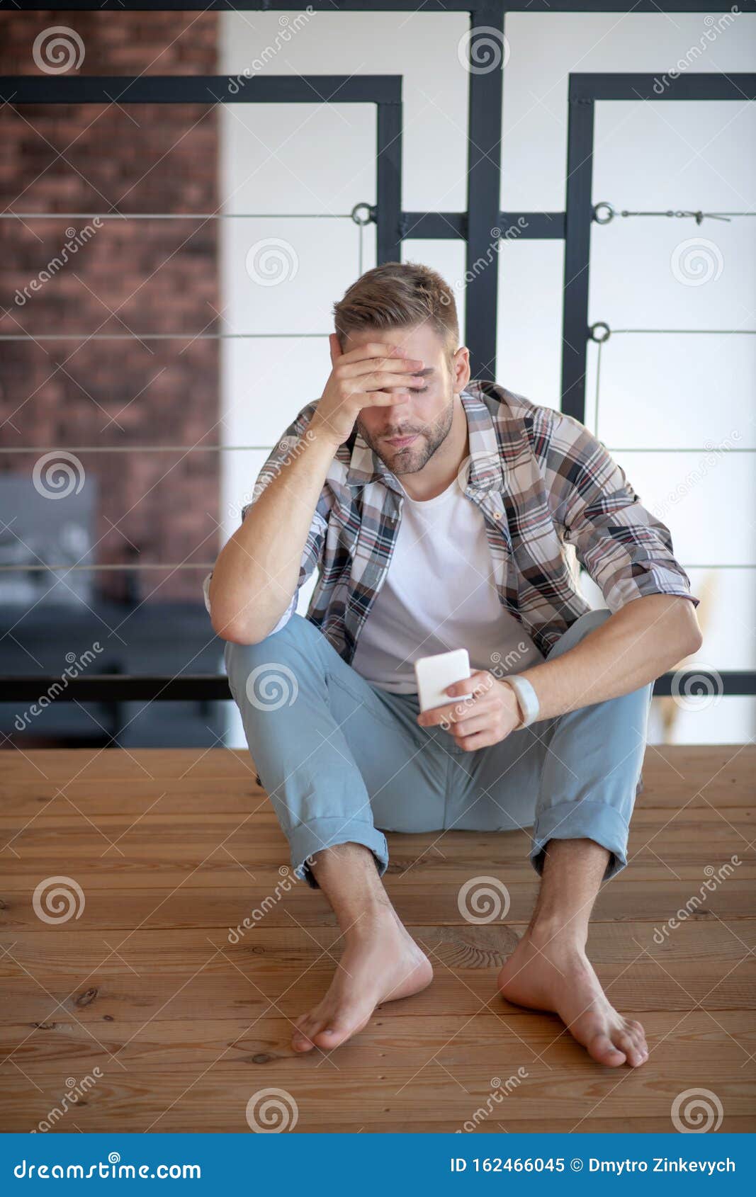 Bearded Man Feeling Concerned after Reading Message from Boss Stock ...