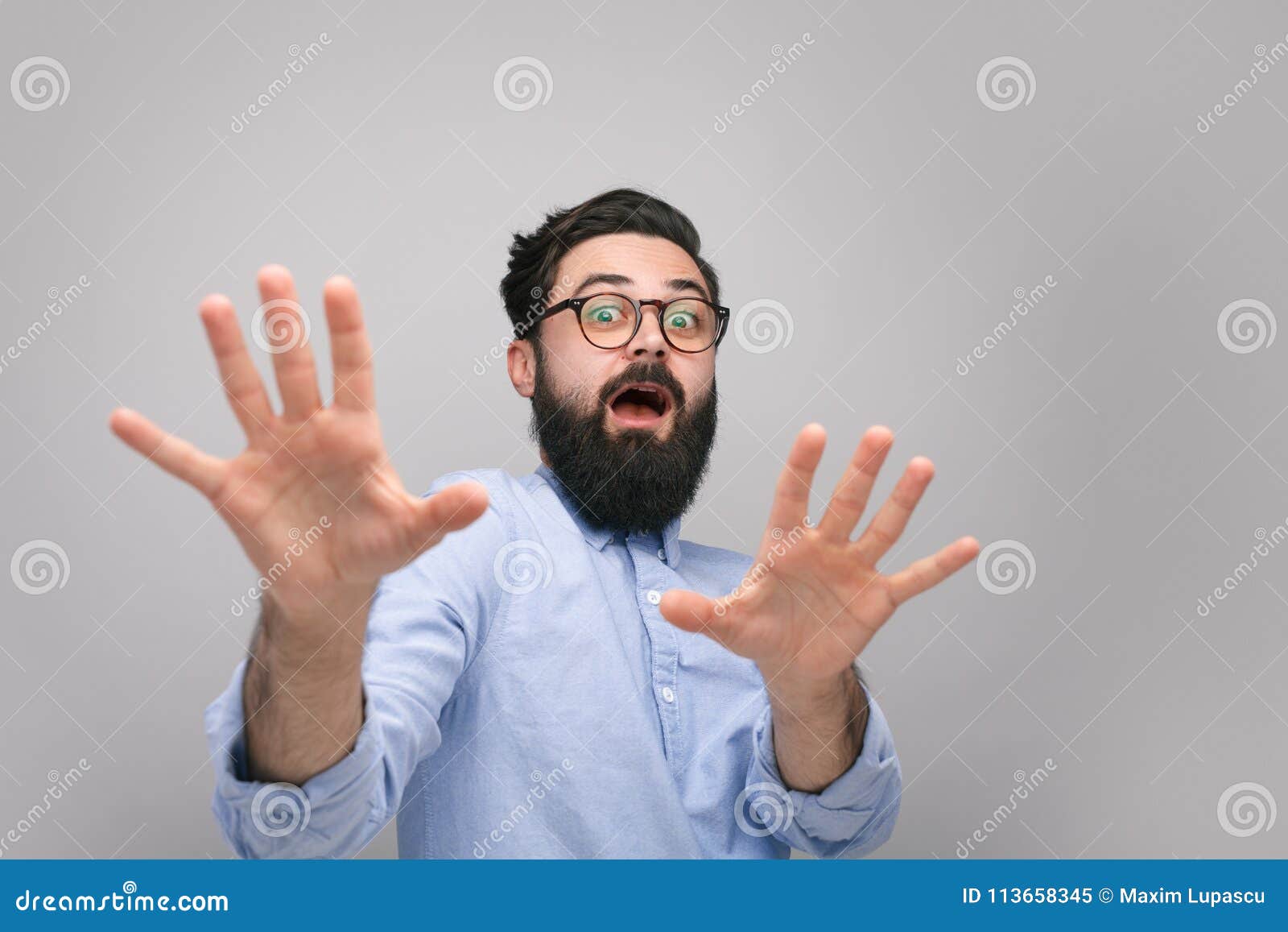 Scared Man Gesturing with Hands on Gray Stock Image - Image of formal ...