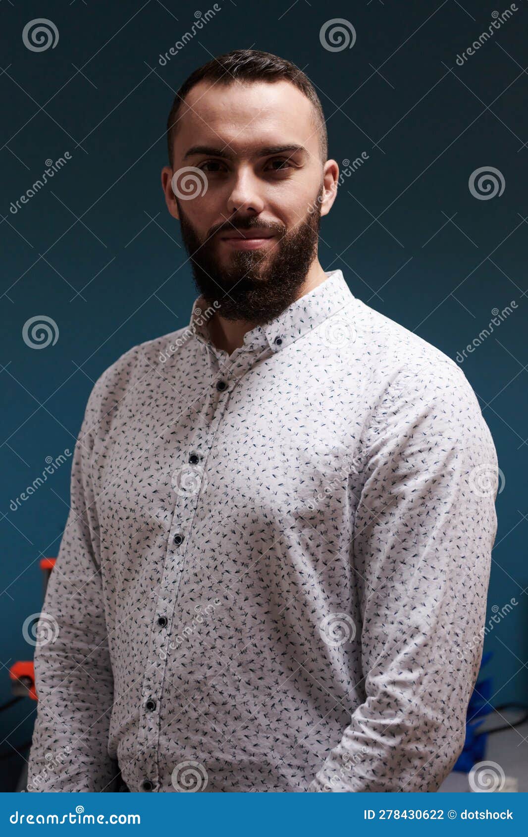 A Bearded Man in a Modern Robotics Laboratory, Immersed in Research and ...