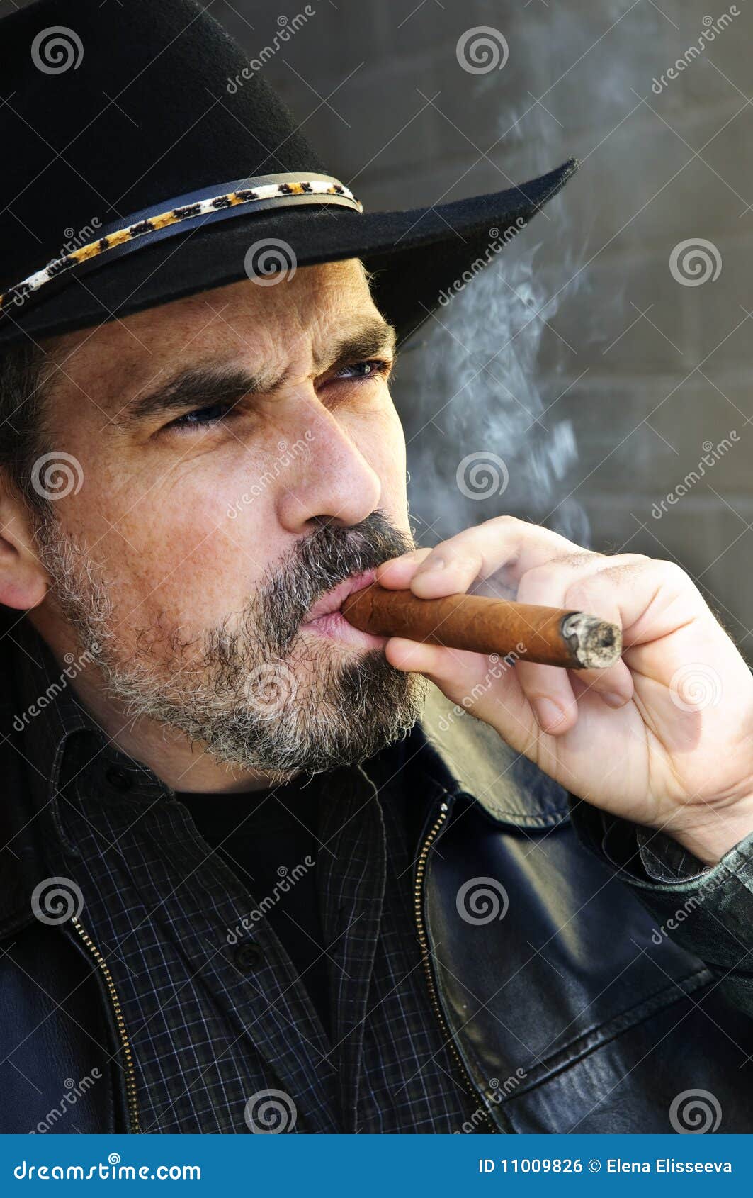 Bearded man smoking cigar stock photo. Image of brick - 11009826
