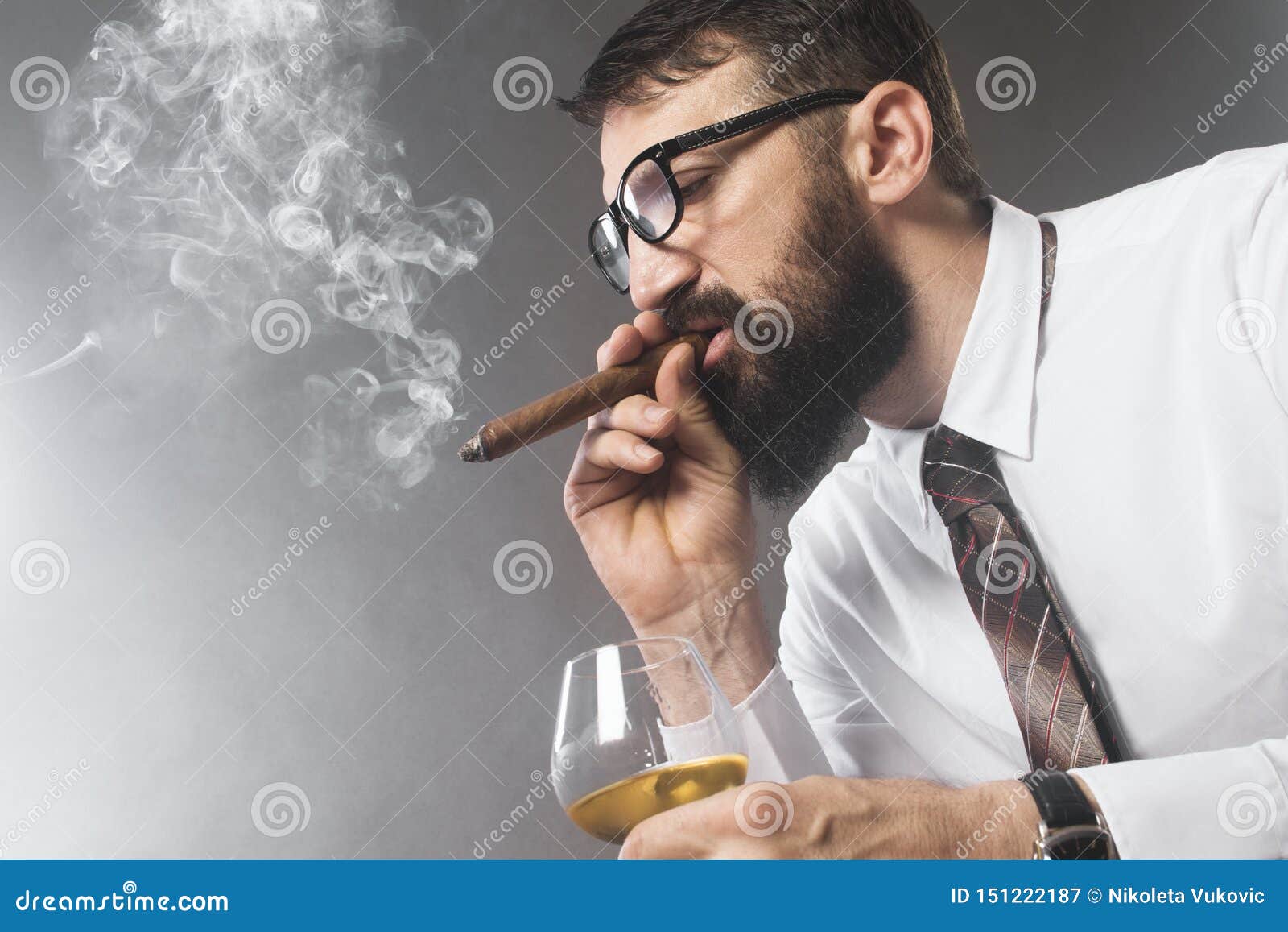 Bearded man smoking cigar stock image. Image of background - 151222187