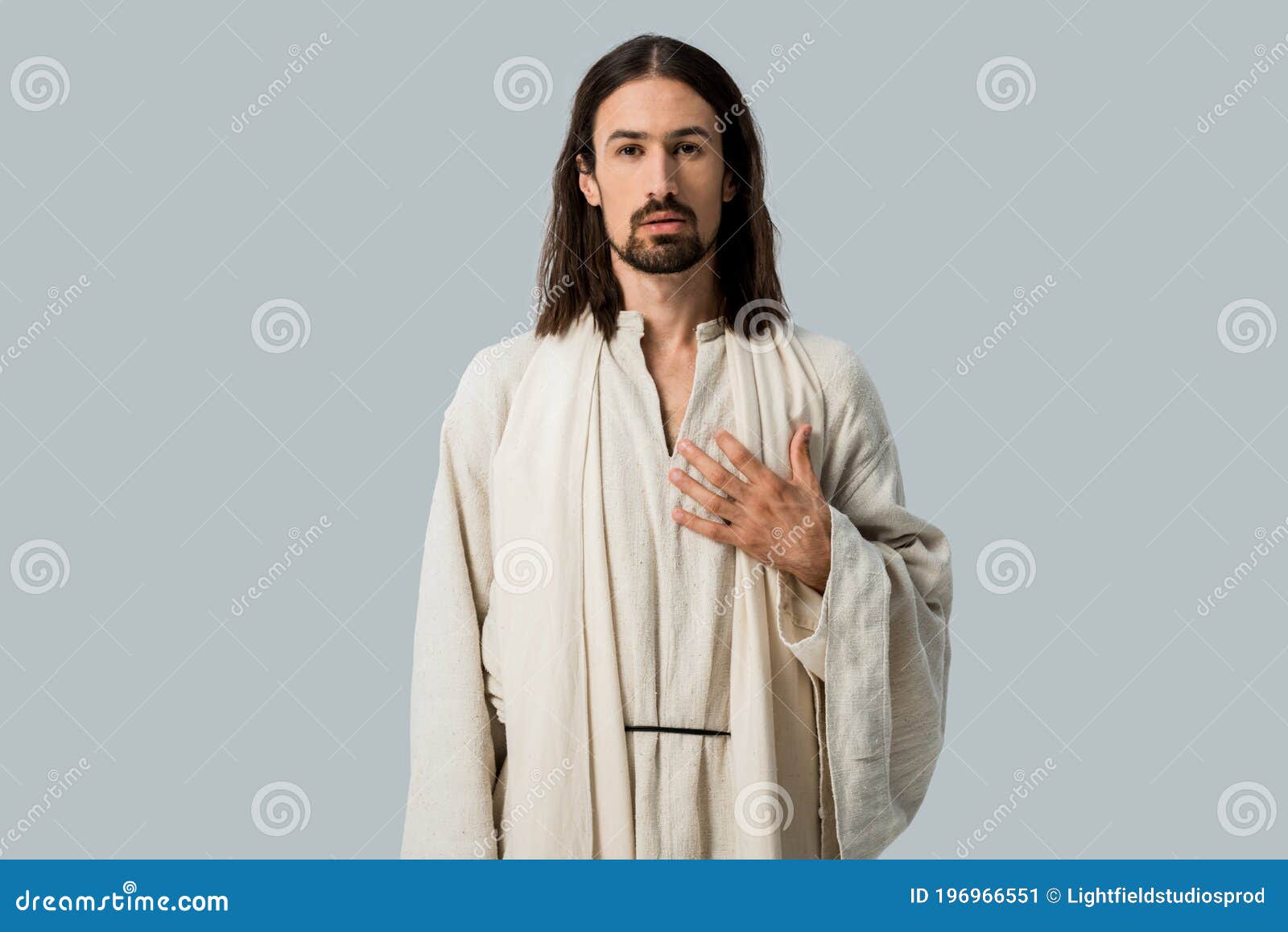 Man Standing with Hand on Chest Isolated on Grey Stock Image - Image of ...