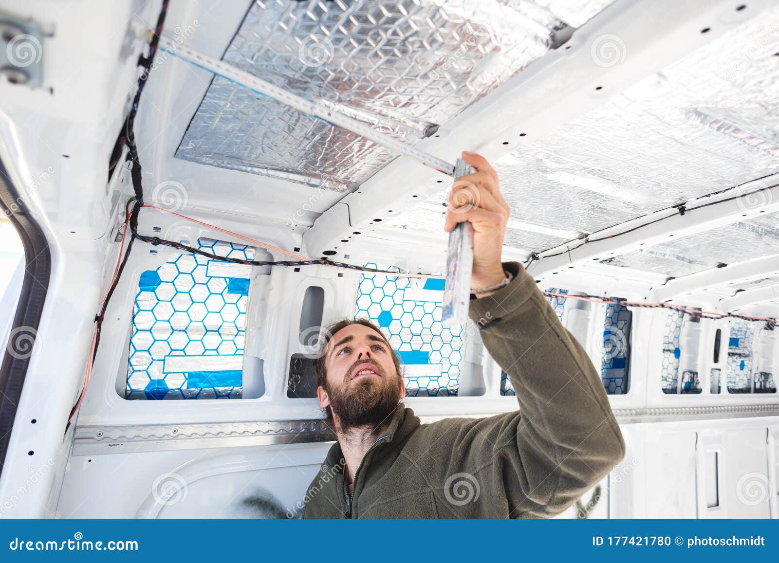 Young Man Inside a Van is Using a Folding Rule Stock Photo - Image of ...