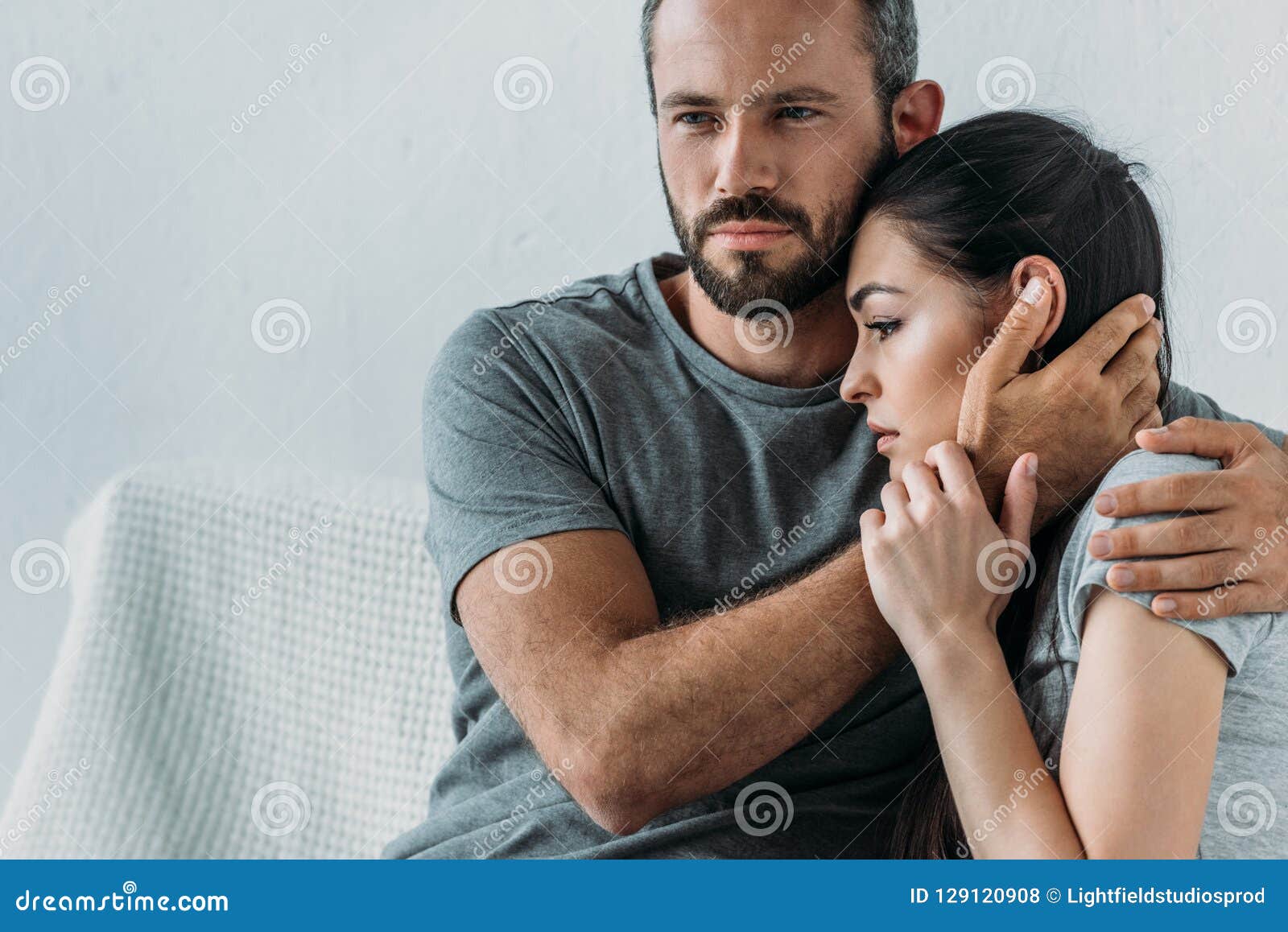 Bearded Man Supporting and Hugging Depressed Woman Sitting Stock Photo ...