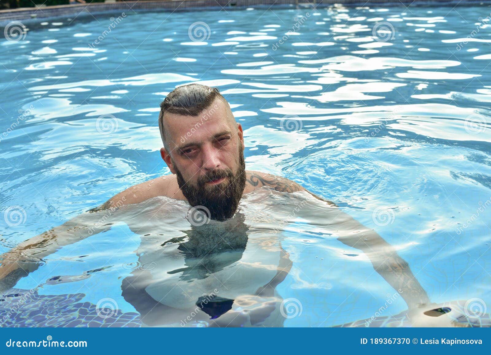 Bearded Man Swimming in a Pool. Man with a Beard in the Pool Stock ...
