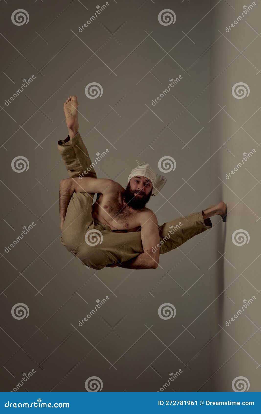 Bearded Man Training Shirtless, Practising Yoga Exercises Against ...