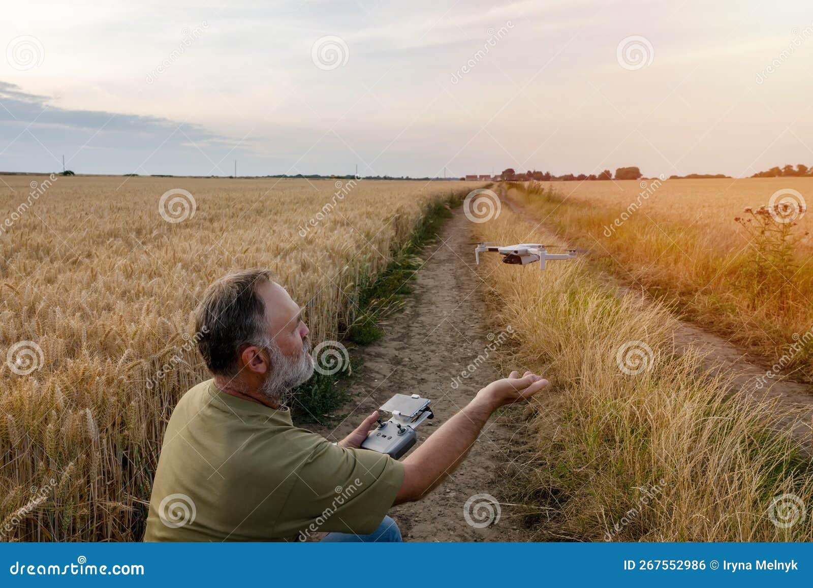 Man Using a Drone with Remote Controller Making Photos and Videos ...