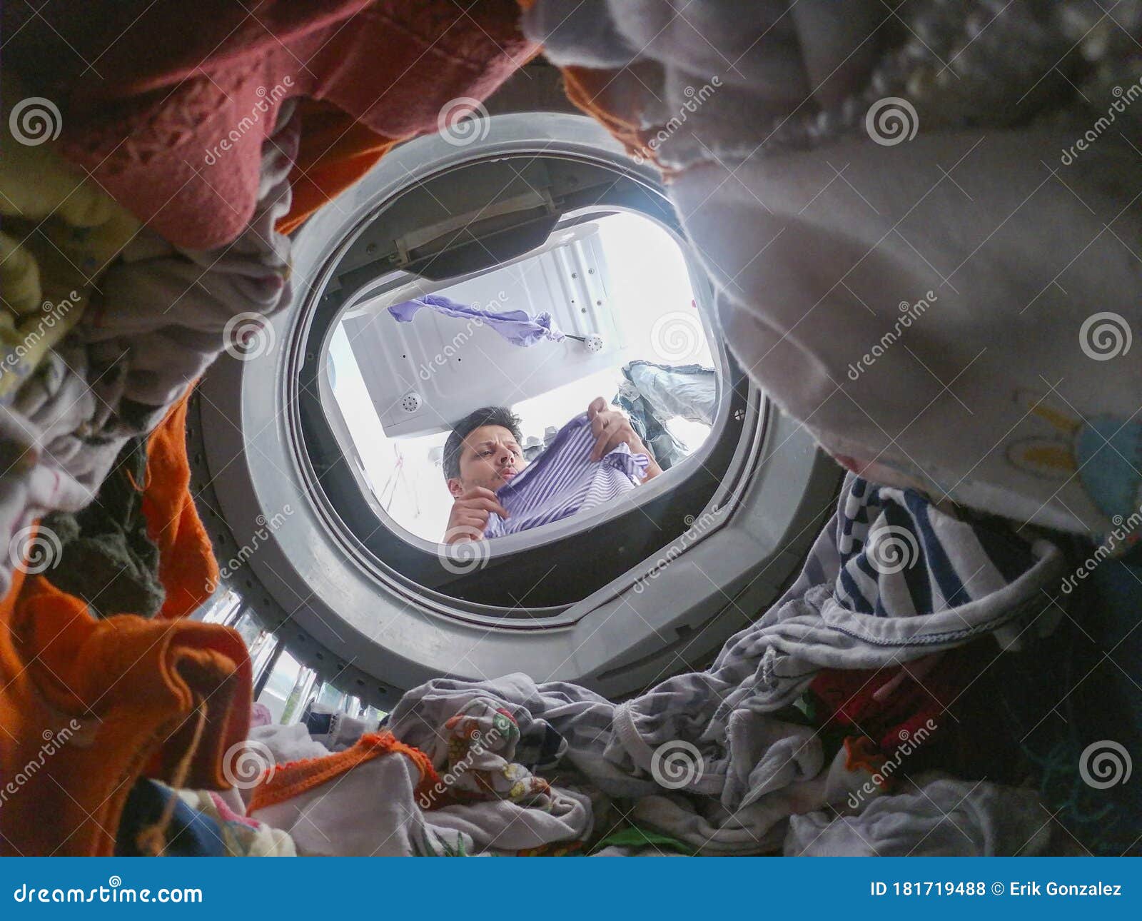 Man Using Washing Machine at Home Stock Photo - Image of laundry ...