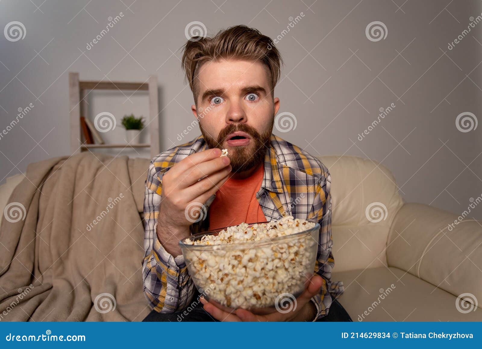 Bearded Man Watching Film Or Sport Games Tv Eating Popcorn In House At