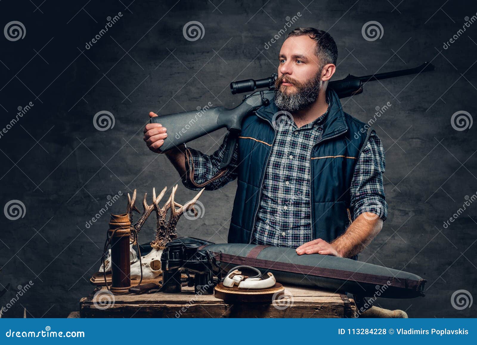 Bearded Modernl Hunter with His Trophy Holds a Rifle. Stock Photo ...