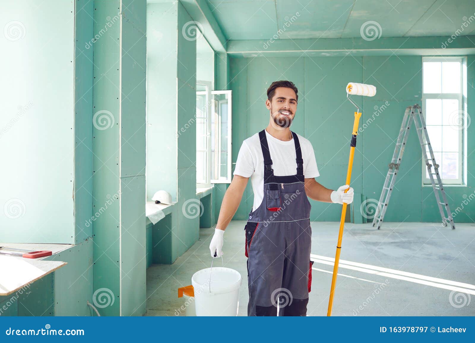 Bearded Painter Construction Worker on a Construction Site. Stock Image ...