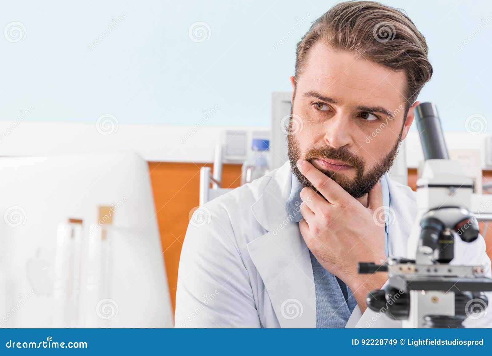 Bearded Scientist Working with Microscope in Laboratory Stock Image ...