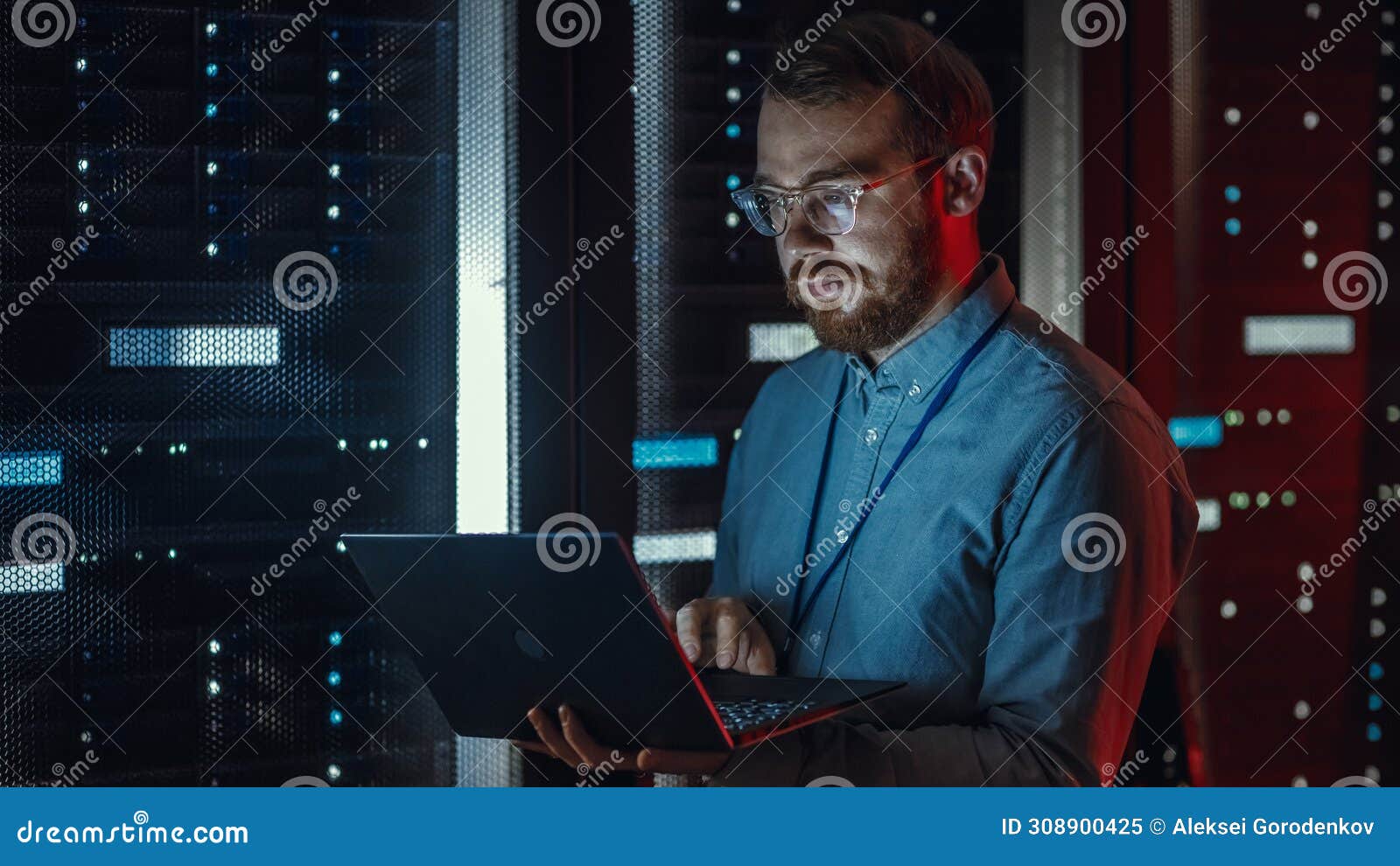 Bearded it Specialist in Glasses is Working on Laptop in Data Center ...