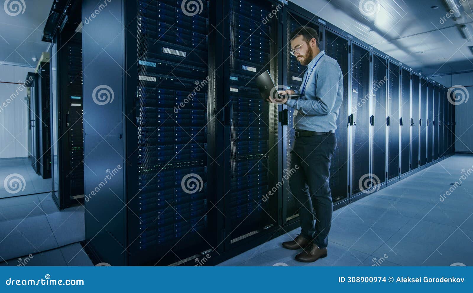 Bearded it Specialist in Glasses is Working on Laptop in Data Center ...