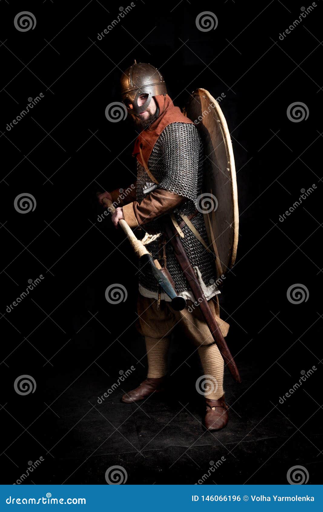 Bearded Warrior in the Armor of the Viking Age Holds a Lance and Sword ...