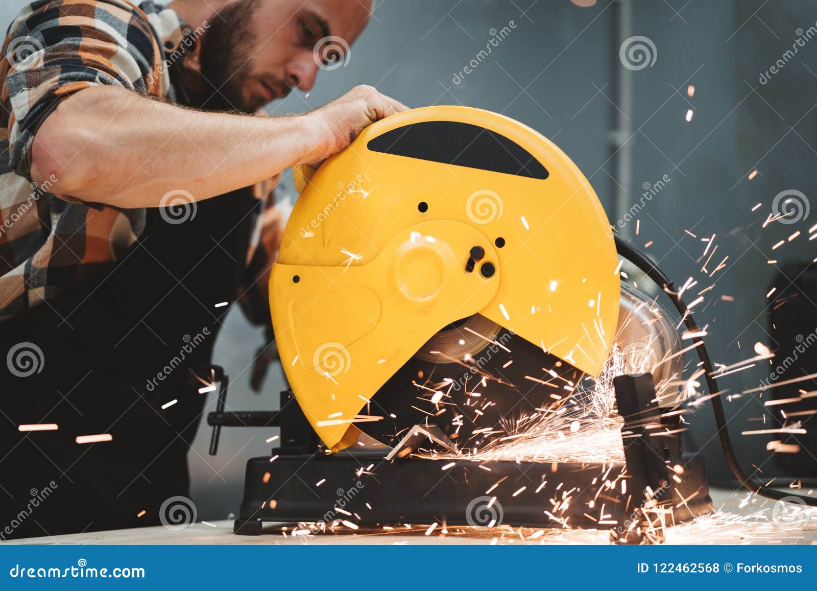 Bearded Worker Using Electrical Grinding Machine in Service Station ...