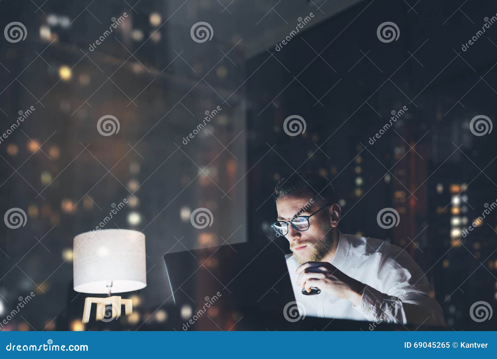 Bearded Young Businessman Working on Modern Loft Office at Night. Man ...