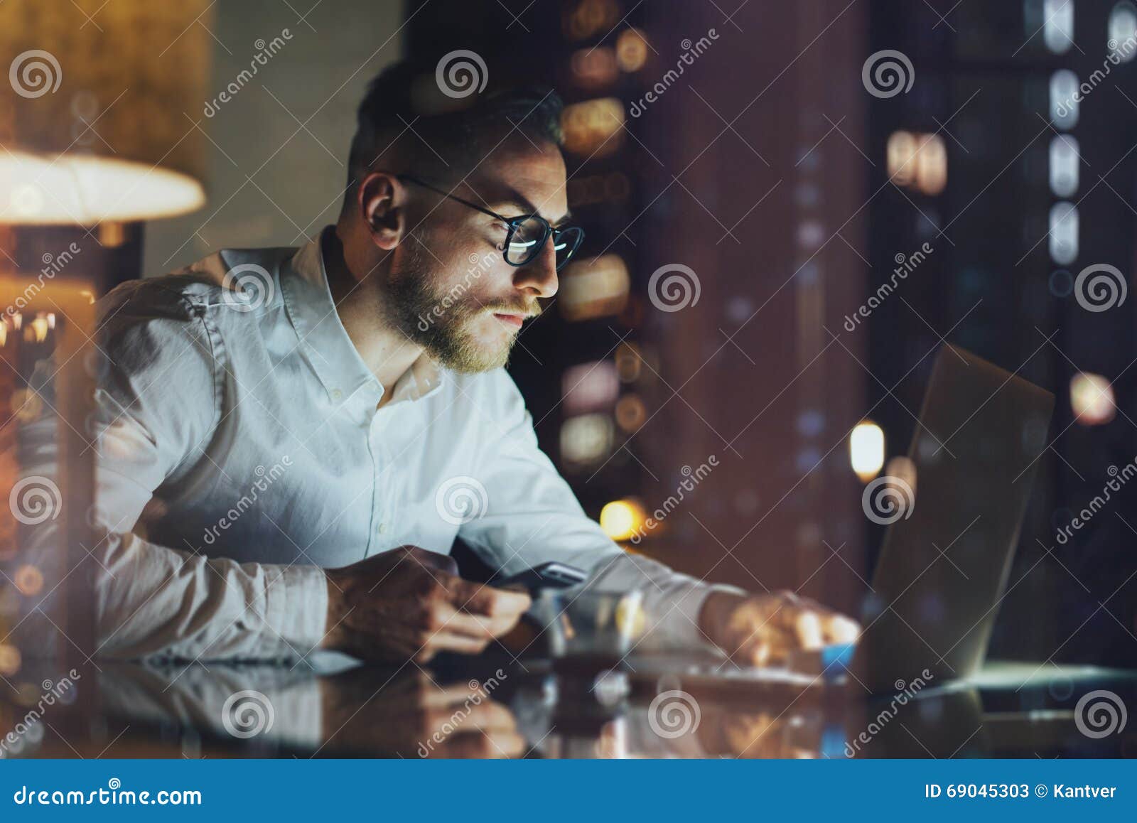 Bearded Young Businessman Working on Modern Loft Office at Night. Man ...