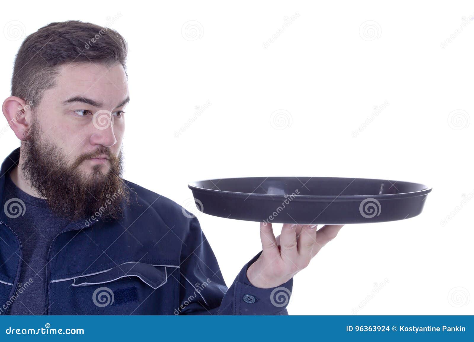 Bearded Young Man with a Tray Stock Photo - Image of unfriendly ...