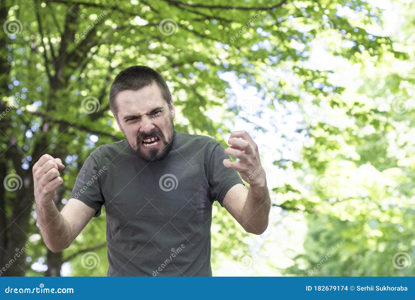 A Bearded Young Man Walks Out of the Park in Anger. Emotional ...