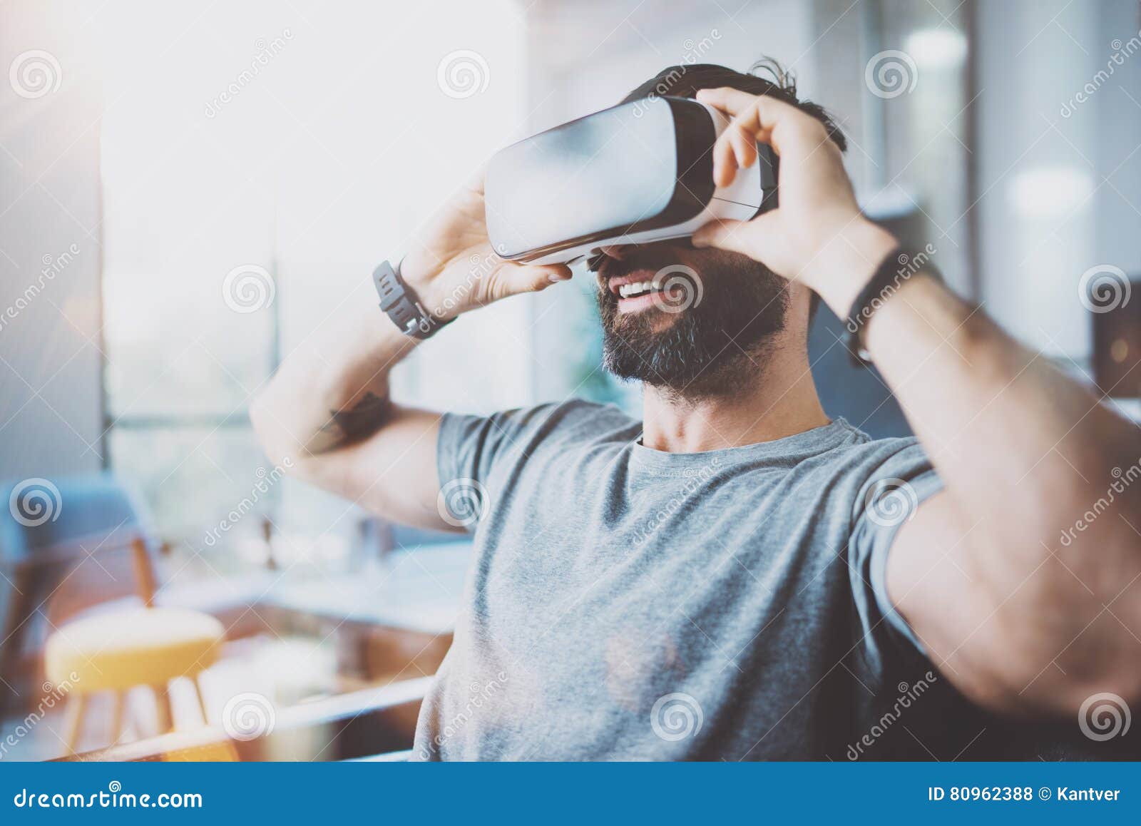 Bearded Young Man Wearing Virtual Reality Goggles in Modern Coworking ...
