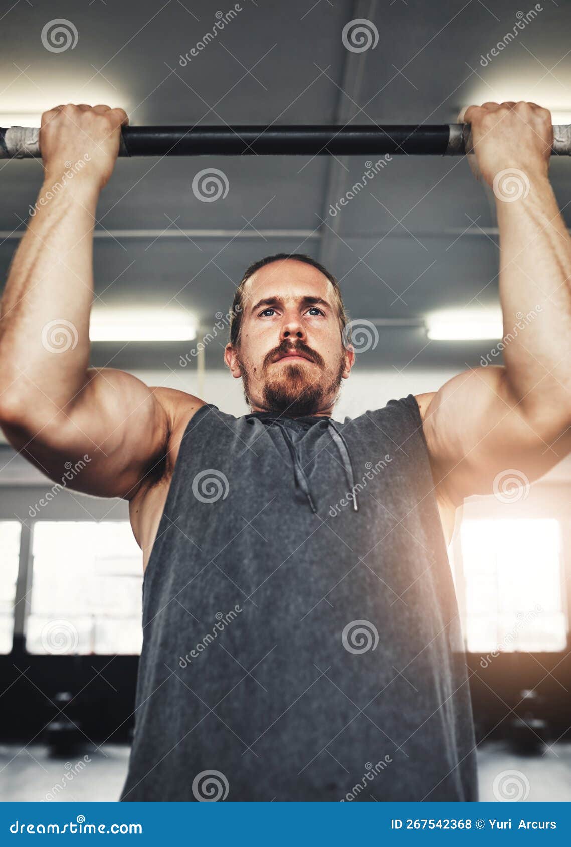 Beast Mode Activated. a Young Man Doing Pull Ups in a Gym. Stock Photo ...