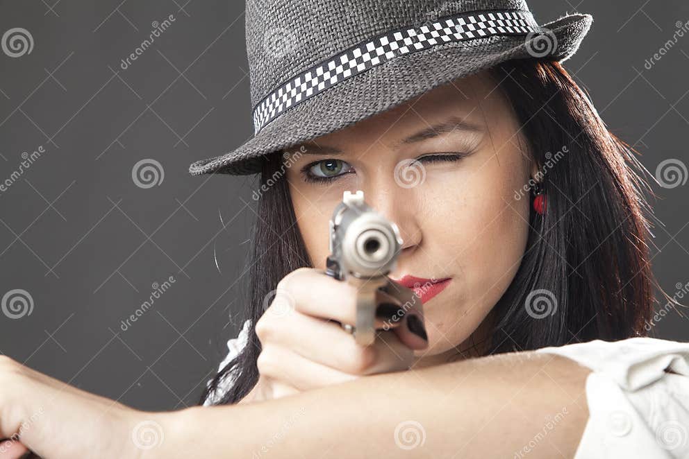 Beatiful girl aiming a gun stock photo. Image of girl - 28081768