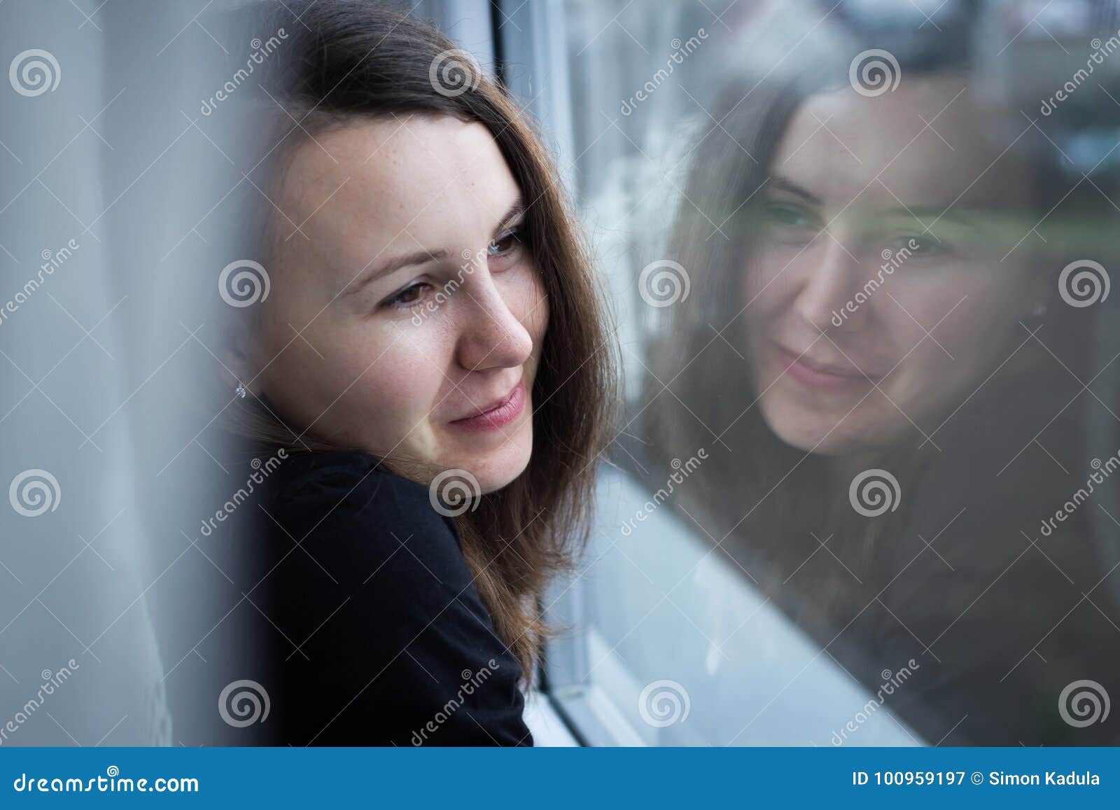 Beatiful Young Girl Watching Out of the Window; Looking from the Stock ...