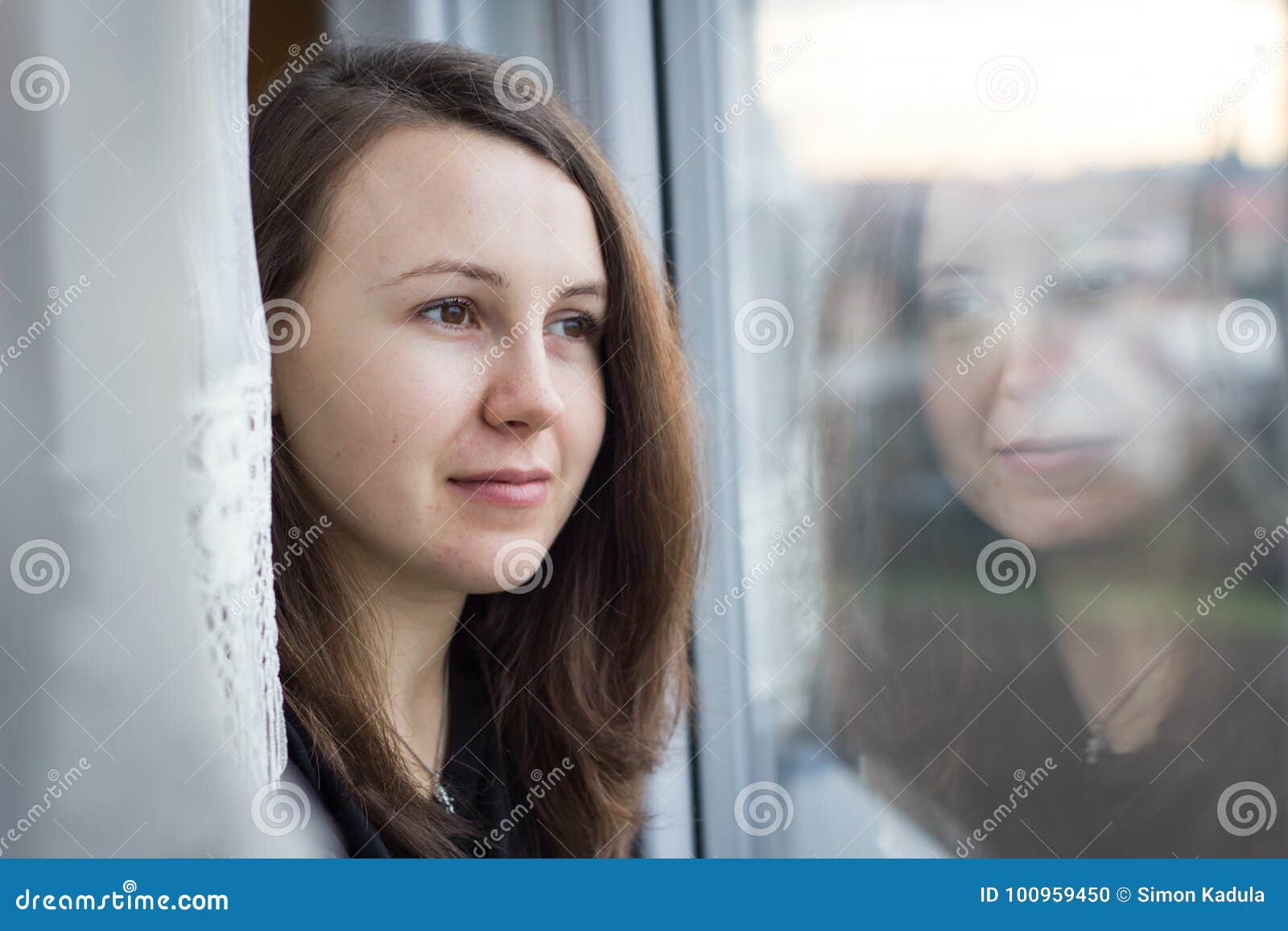 Beatiful Young Girl Watching Out of the Window; Looking from the Stock ...