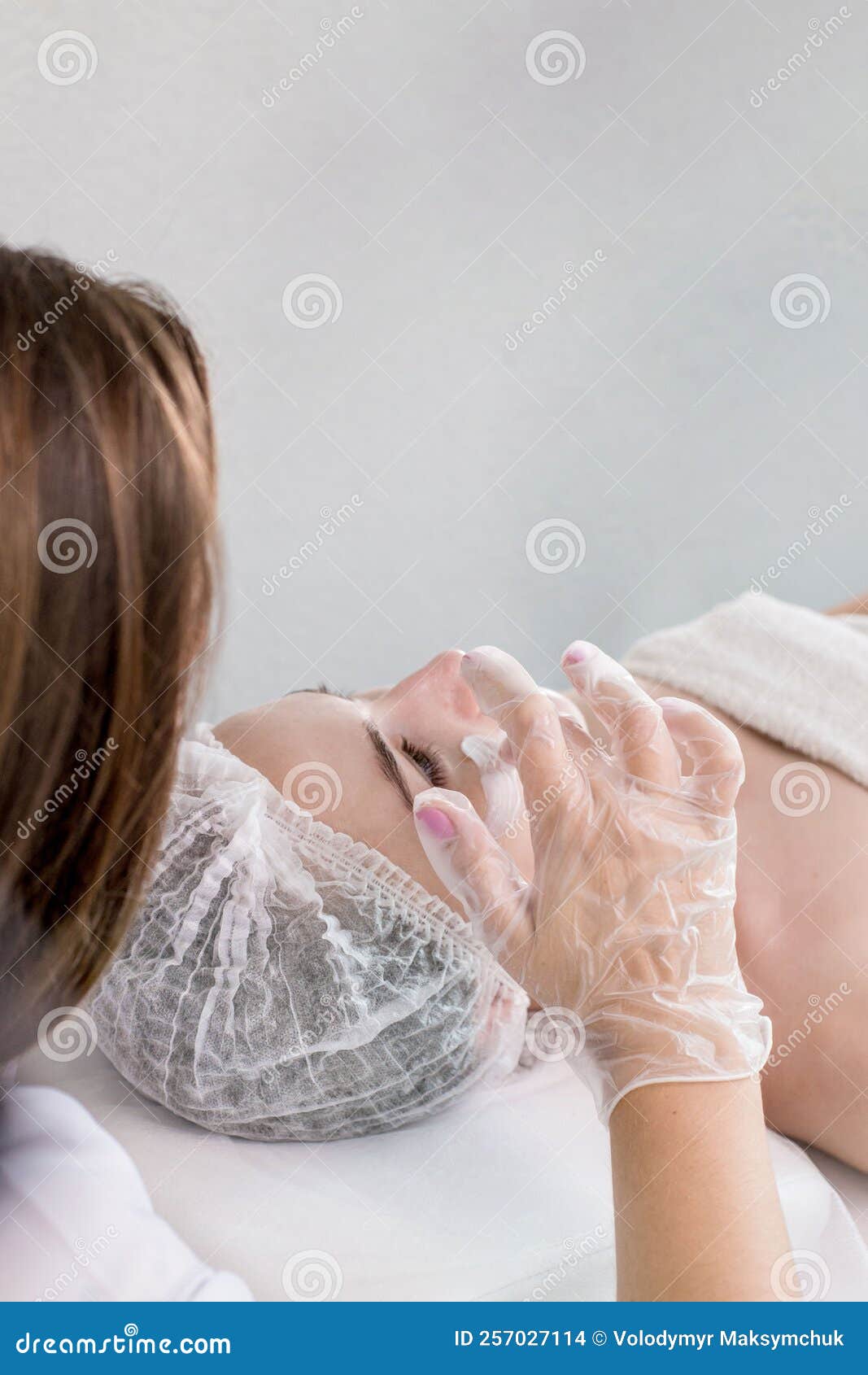 A Beautician Applied A Drop Of Cream To A Young Womanand X27 S Face Skin