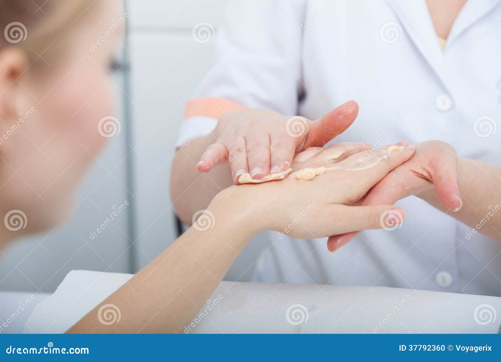 Beautician Applying Moisturizing Cream on Client Hands. Beauty Salon ...