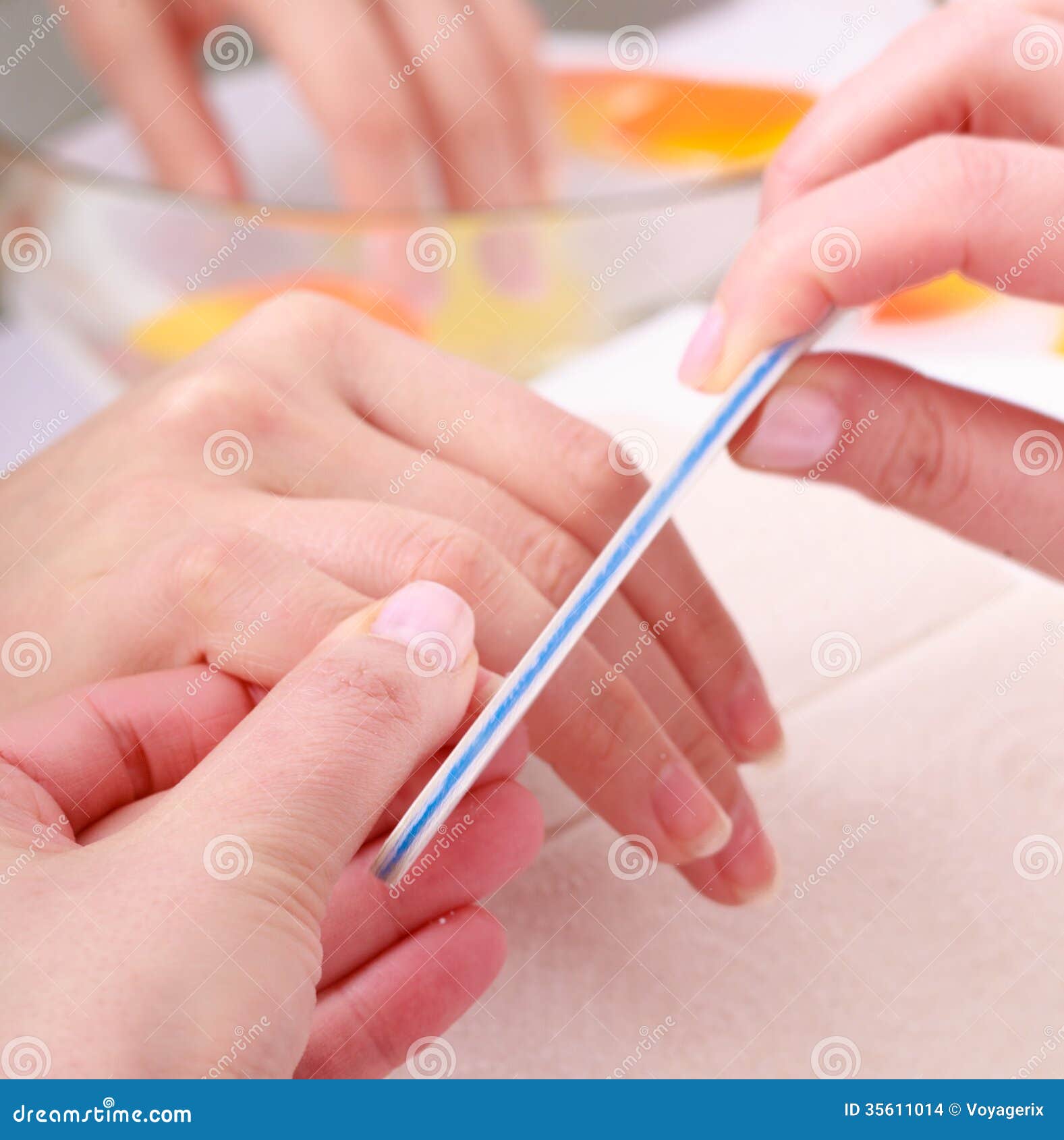 Beautician With File Filing Nails Female Client Woman Spa Beauty Salon